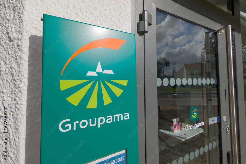 Groupama logo brand facade green and text sign chain of office building ...