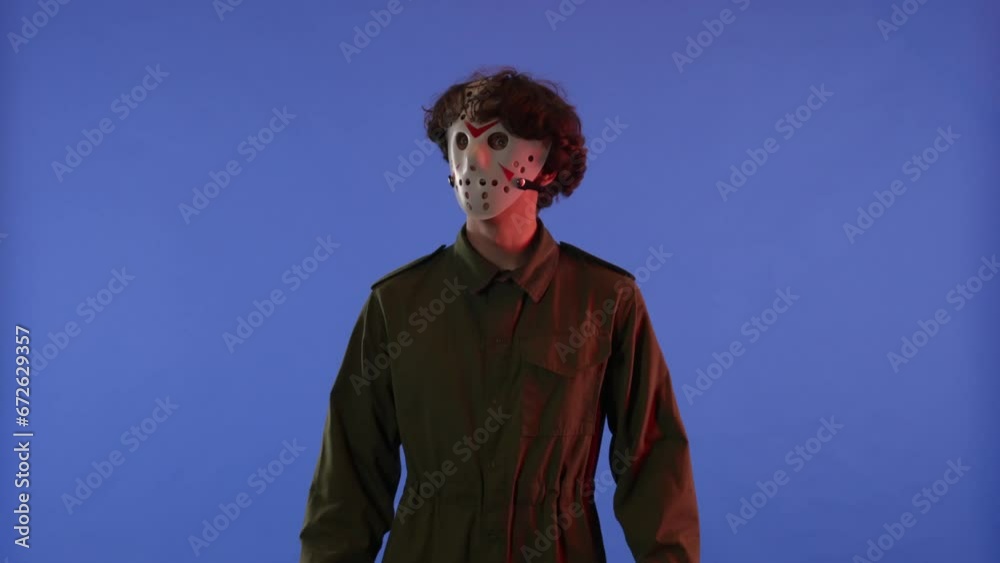 Man in white mask looking around and showing OK gesture with fingers on ...