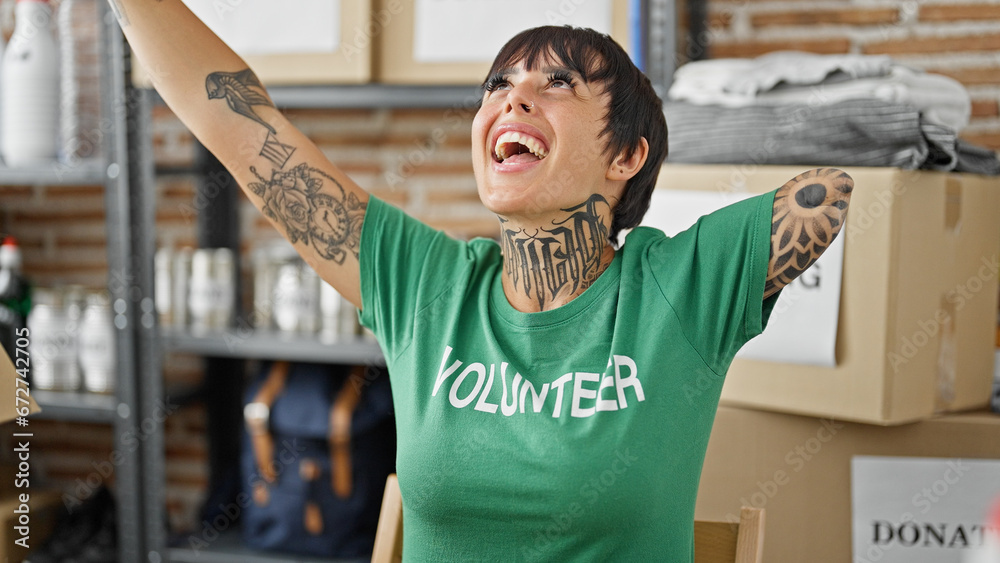 Hispanic woman with amputee arm volunteer smiling confident sitting on ...