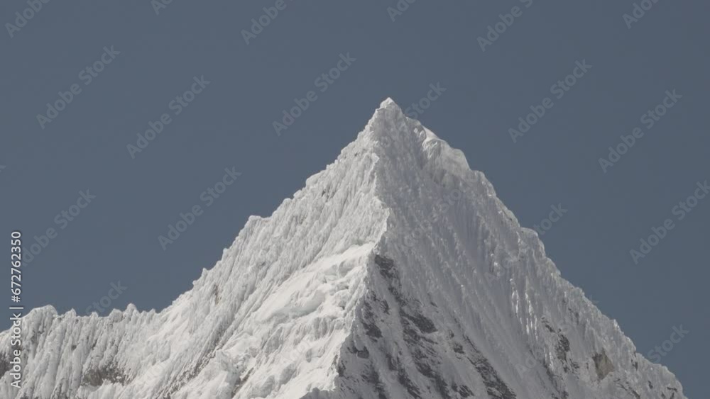 ice covered glacier of a pyramid shaped mountain at laguna paron lagoon ...