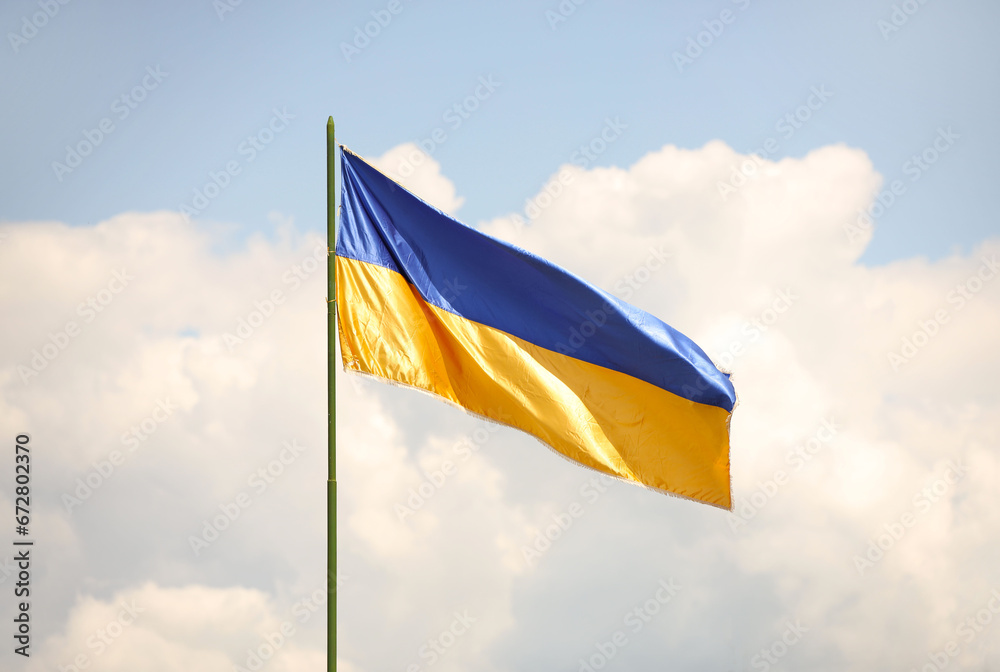 The national flag of Ukraine is developing. Blue and yellow banner ...