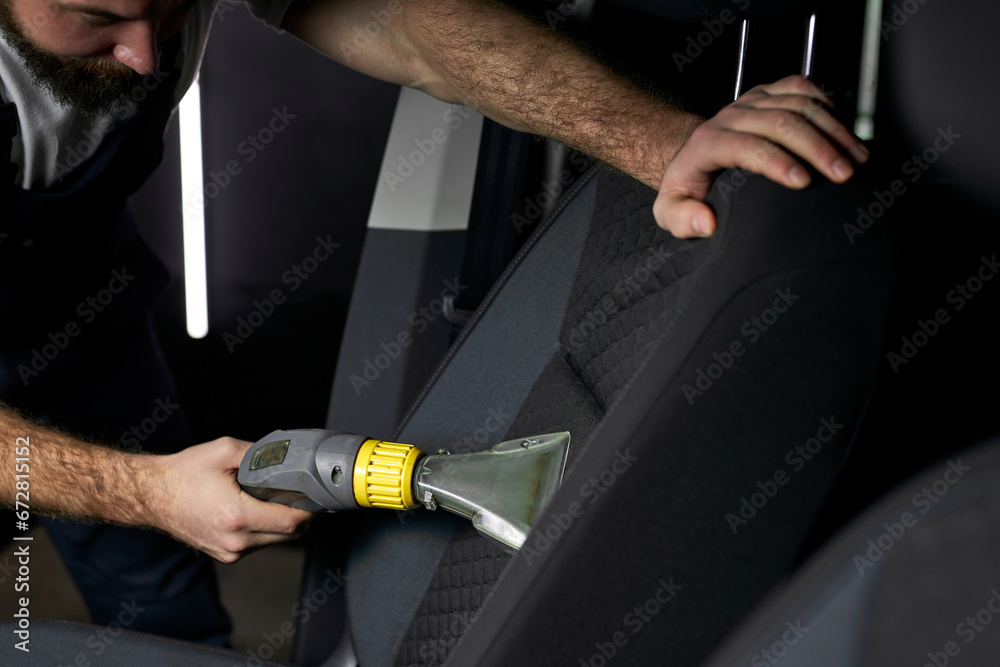 Car seat vacuum, car detailing and cleaning of interior seats at luxury ...