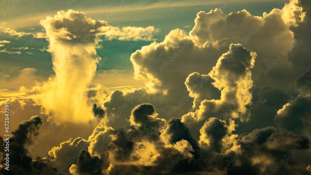 Dramatic evening storm front during golden hour in summer, with bright ...