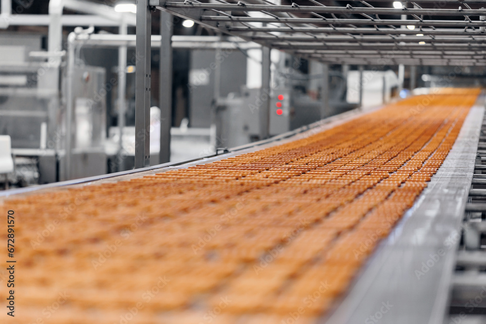 Automatic bakery plant food factory. Belgian waffles on conveyor ...