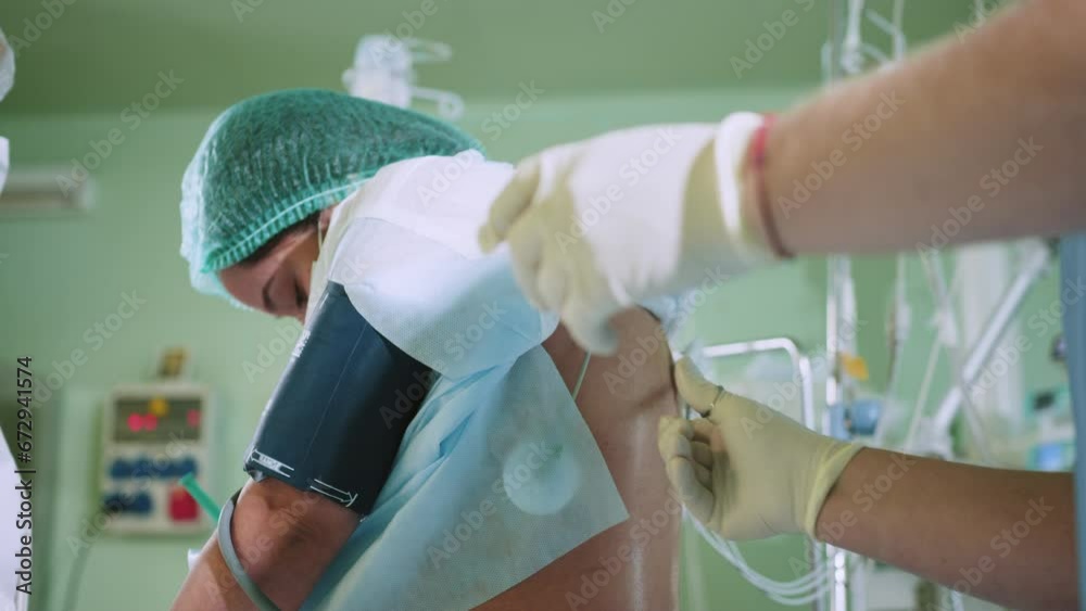 Male doctor injecting Epidural Anesthesia for pregnancy Labor during ...