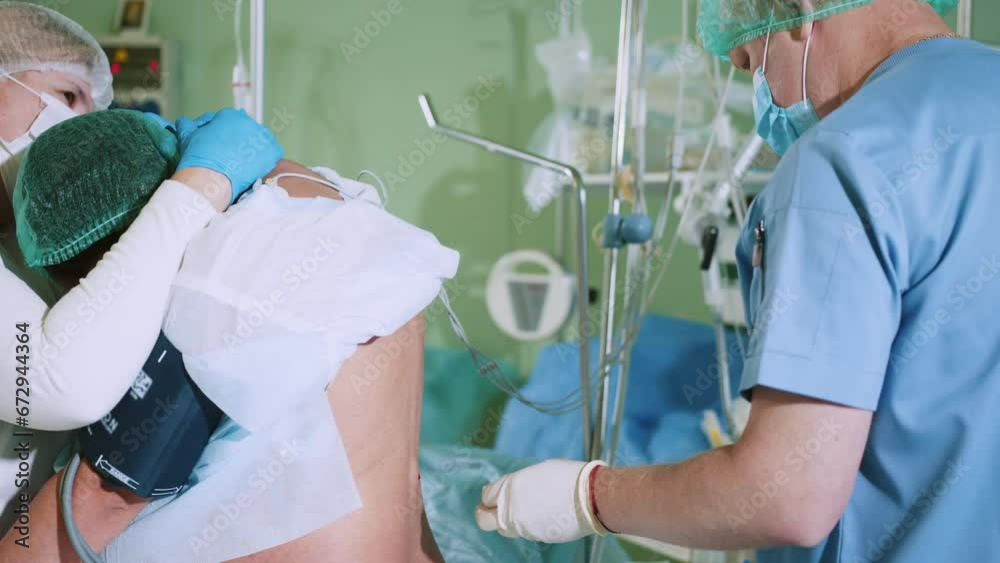 Male doctor injecting Epidural Anesthesia for pregnancy Labor during ...