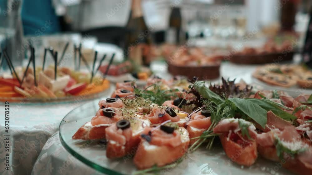 Catering service on banquet table with canape snacks in restaurant or ...