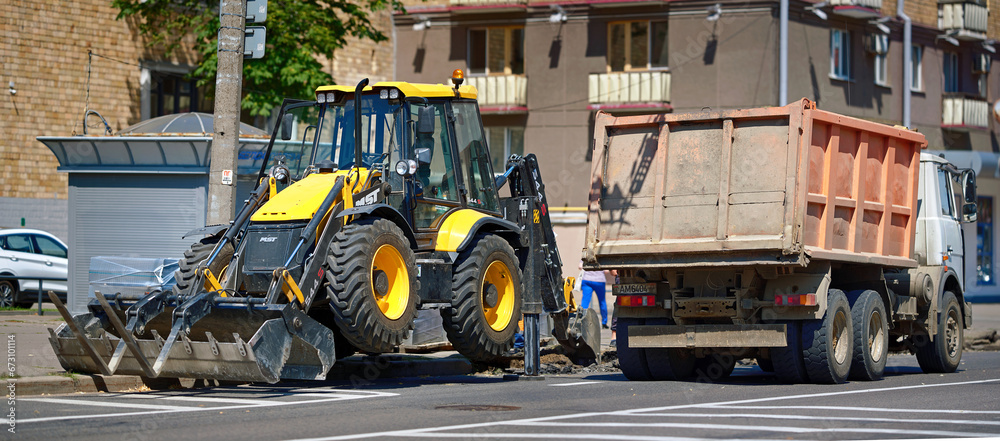 Minsk, Belarus. Jul 14, 2023. MST M544S backhoe loader dig asphalt road ...