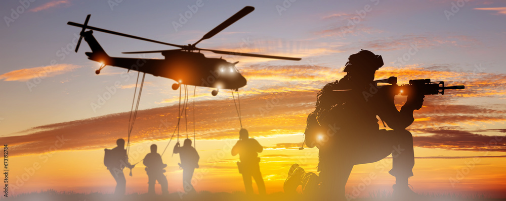 Soldiers at sunset. Military people with weapons. Silhouette helicopter ...