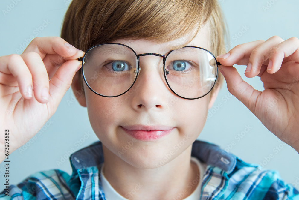 Little boy wearing glasses at ophthalmologist's office. Boy child kid ...