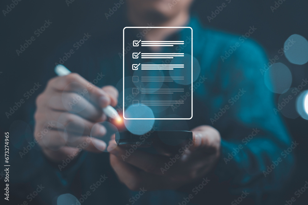 Businessman using electronic pen to tick correct sign mark in online ...