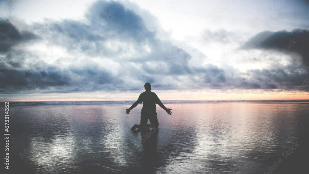 Kneeling In Praise And Worship In Subtle Ocean Waves At Sunset Dusk ...