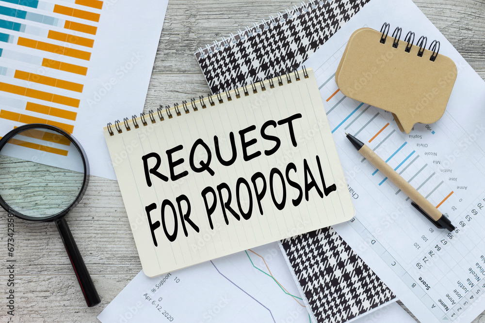Business Acronym RFP - Request for Proposal. financial charts. paper with text on a notepad ...