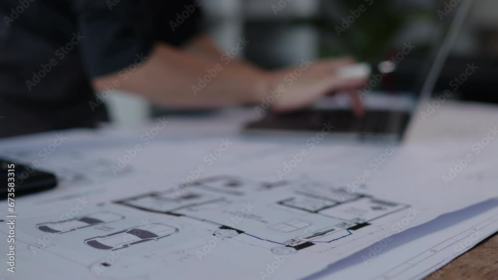 Engineer or architect working and calculations on paperworks blueprints ...