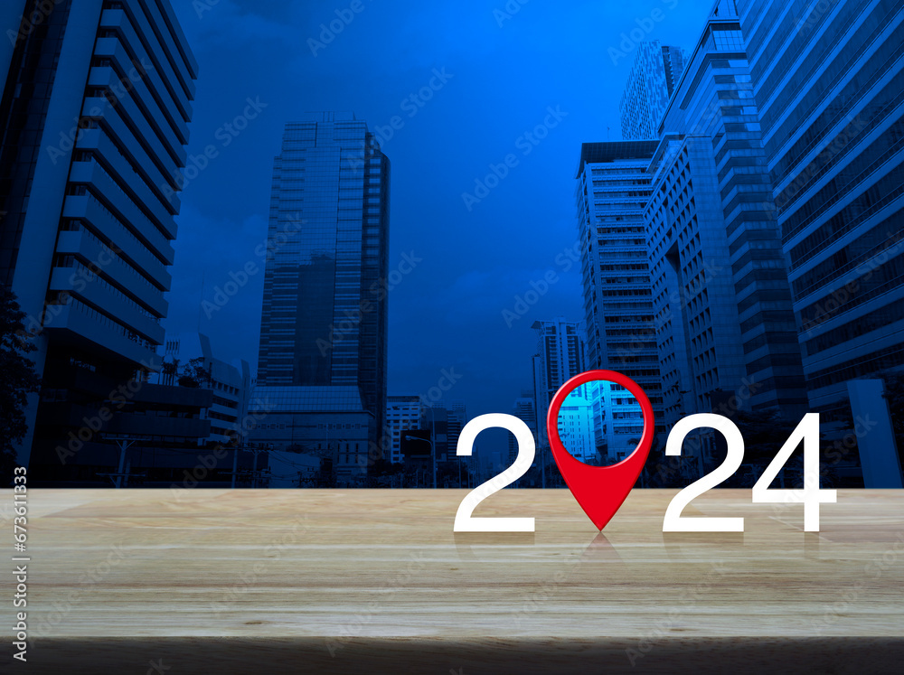 2024 letter with map pin location icon on wooden table over modern ...