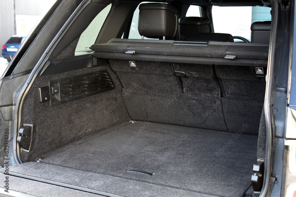 Huge, clean and empty car trunk in interior of lux suv. Rear view of a ...