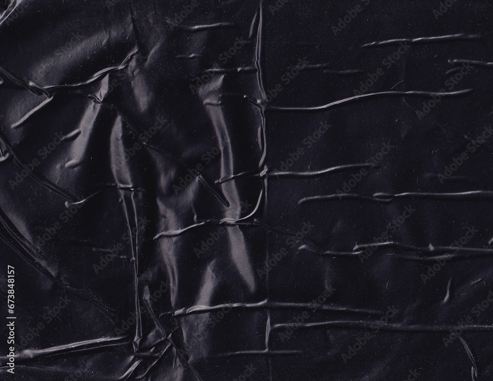 Crumpled black plastic surface background. Creased dark plastic texture ...