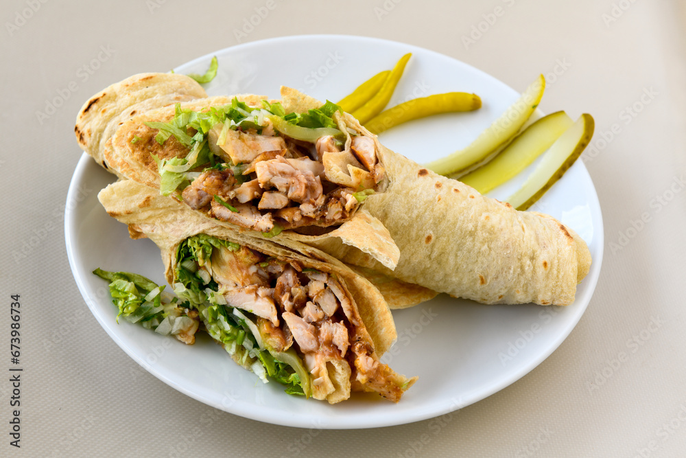 Lavash doner kebab ( zurna doner durum ) or shawarma sliced in plate ...