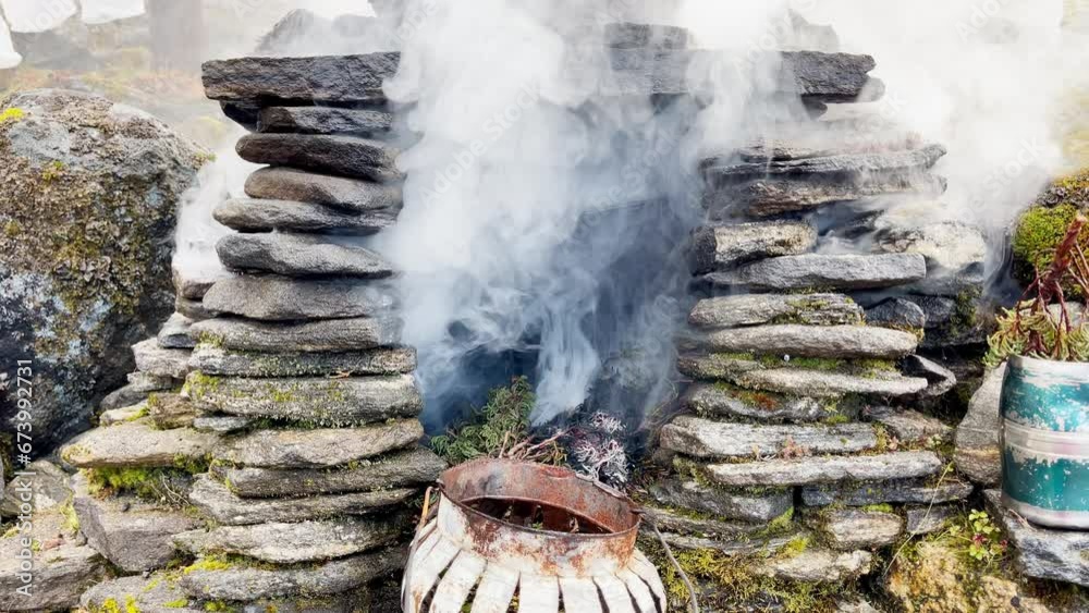 Holy puja ceremony fireplace. Smoke flying up and covering Holy ...