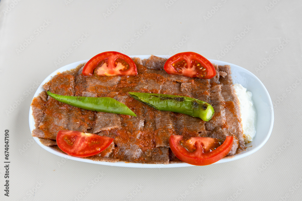 Turkish and Arabic Traditional Ramadan doner kebab with tasty tomato ...