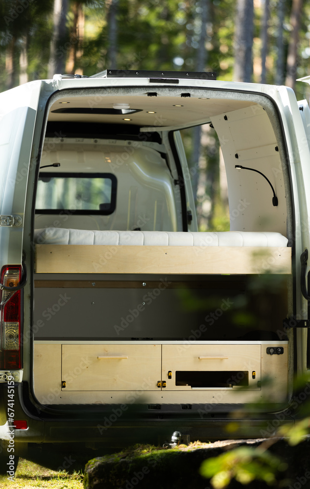 Selfmade campervan conversion back doors open wood interior in Norway ...