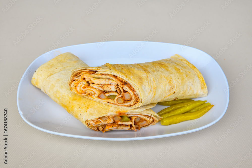 Lavash doner kebab ( zurna doner durum ) or shawarma sliced in plate ...