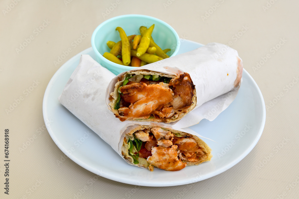 Lavash doner kebab ( zurna doner durum ) or shawarma sliced in plate ...