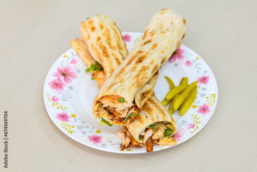Lavash doner kebab ( zurna doner durum ) or shawarma sliced in plate ...
