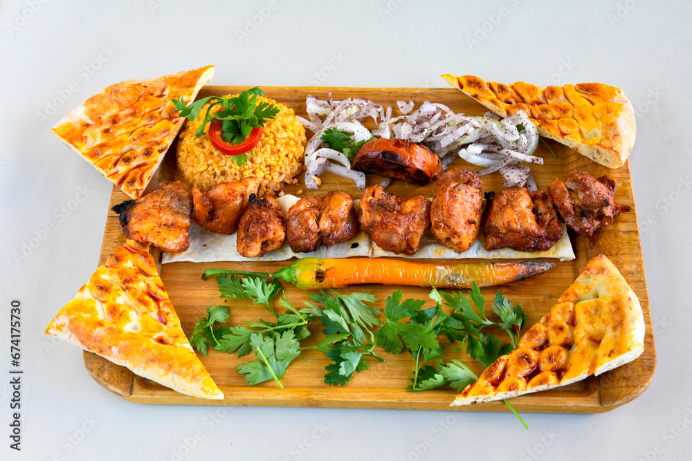 Chicken wings barbeque in a dish with BBQ grill sauce . Izgara tavuk ...