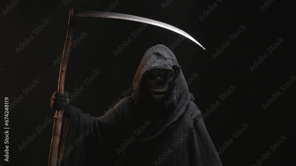 Vidéo Stock Skeleton, skull, silhouette of a man in a black robe ...