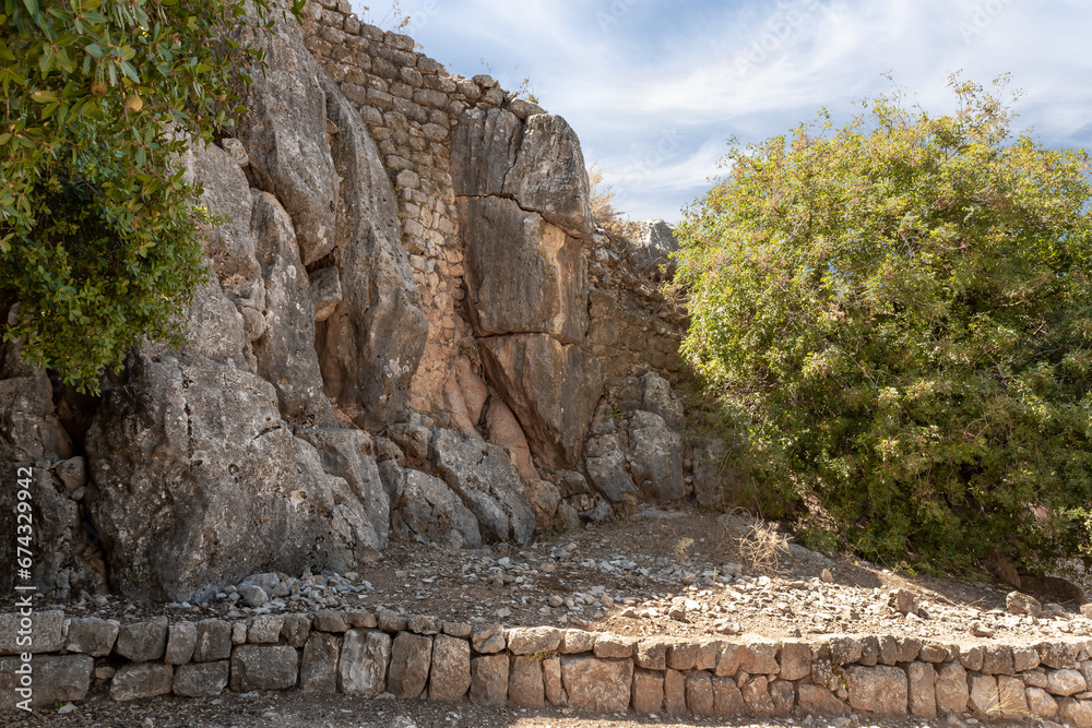 The remains of fortress walls built with a rock in the medieval ...