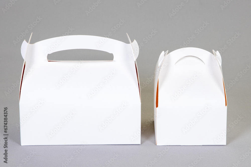 White blank paper pastry two candies box with handle in grey background ...