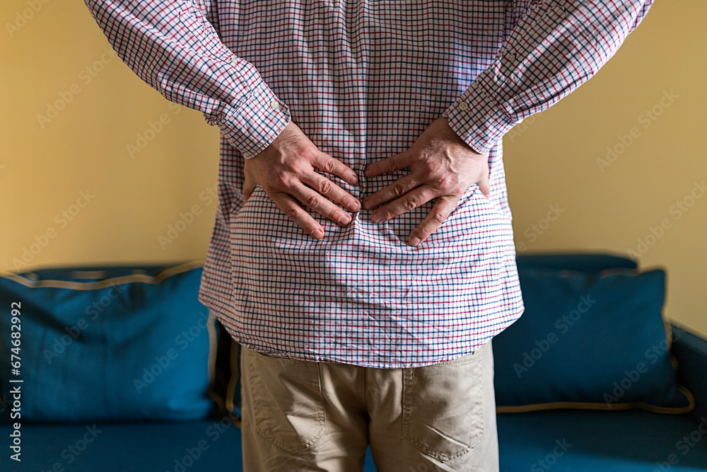 Man Is Touching His Back Because It Aches. Backache Concept Bending ...