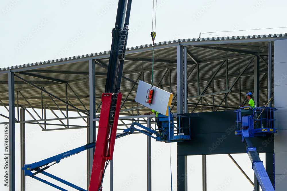 Sandwich panels wall assembly using telescopic boom crane and two self ...
