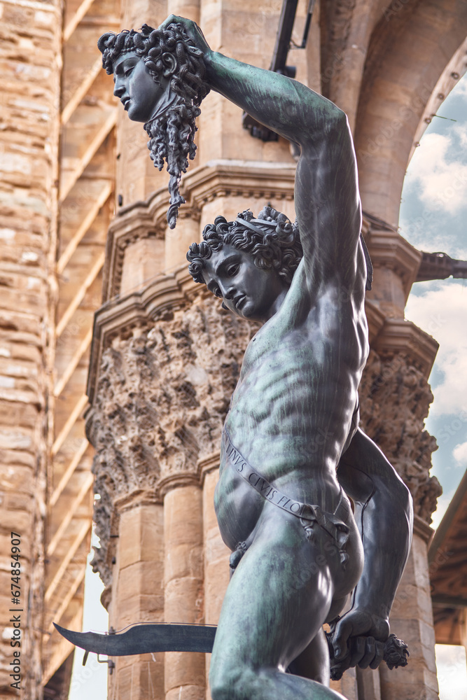 Bronze statue of Perseus with the head of Medusa seen from the side and ...