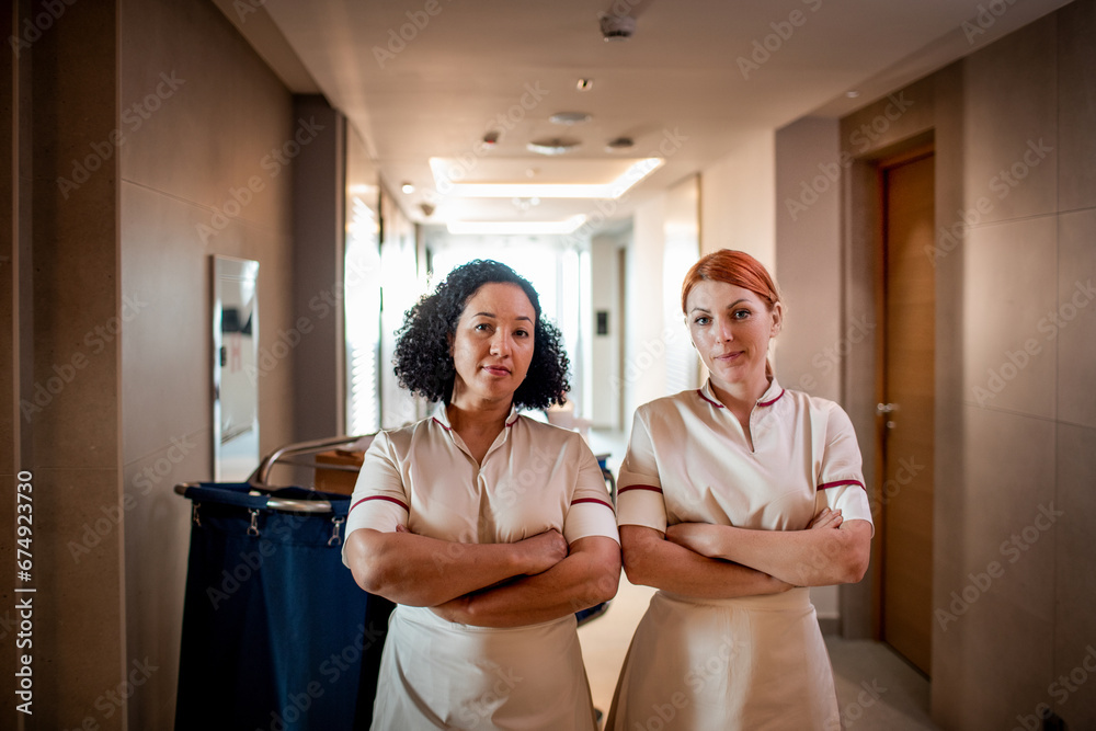 Confident Housekeeping Staff Standing in Hotel Corridor Stock Photo ...