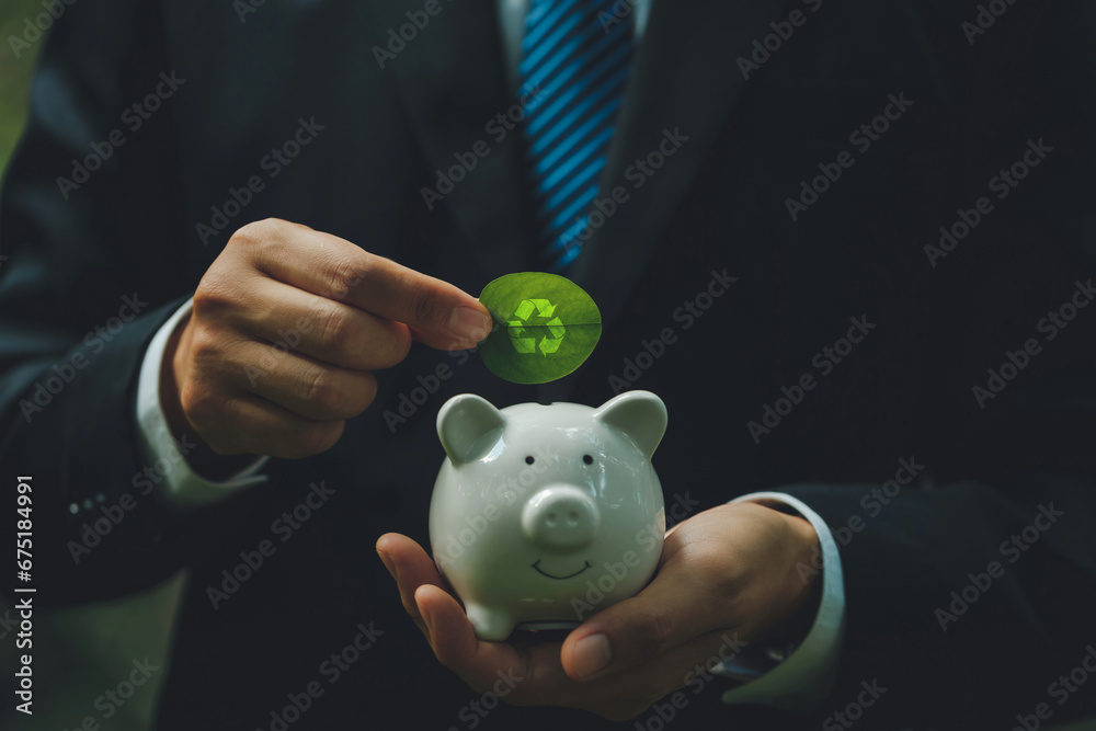 Recycle, Saving, and Investment concept. Businessmen hold green leaves ...