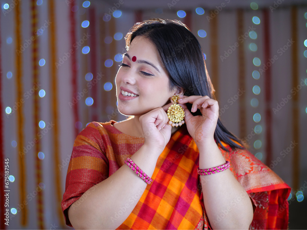 A beautiful young Bengali woman getting ready for the celebration of ... A beautiful young Bengali woman getting ready for the celebration of ...