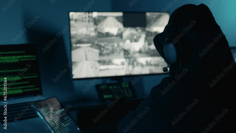 A hacker breaks into company data servers in dark atmosphere and has ...