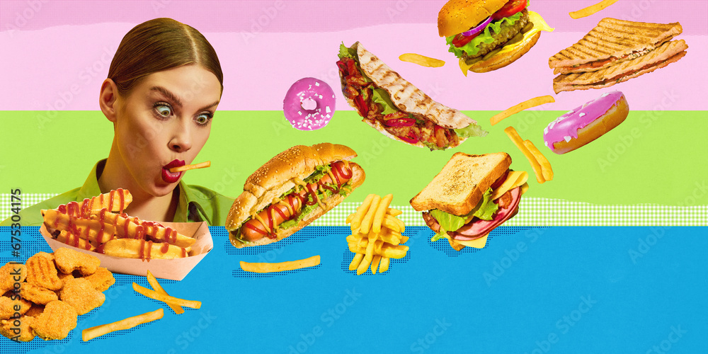 Emotional young woman eating fast food with pleasure. Burger, hot dog ...