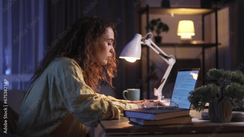 Busy girl freelancer having remote work on laptop checking email ...