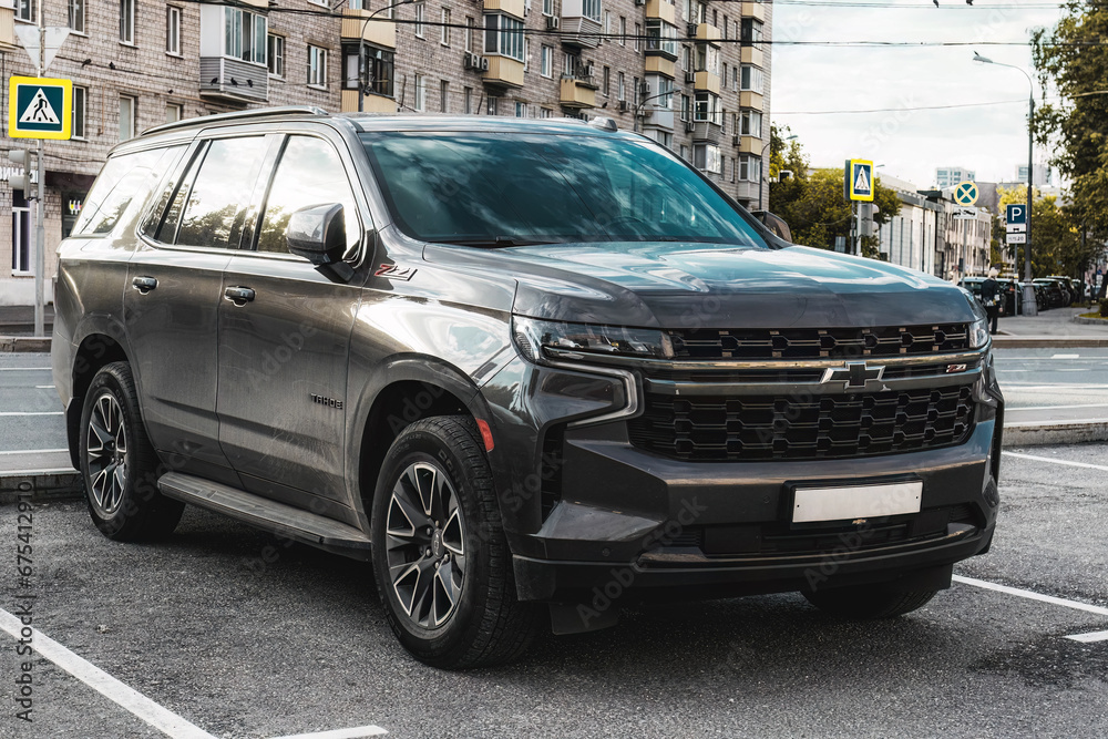 Chevrolet Tahoe full-size SUV parked on street, front side view Stock ...