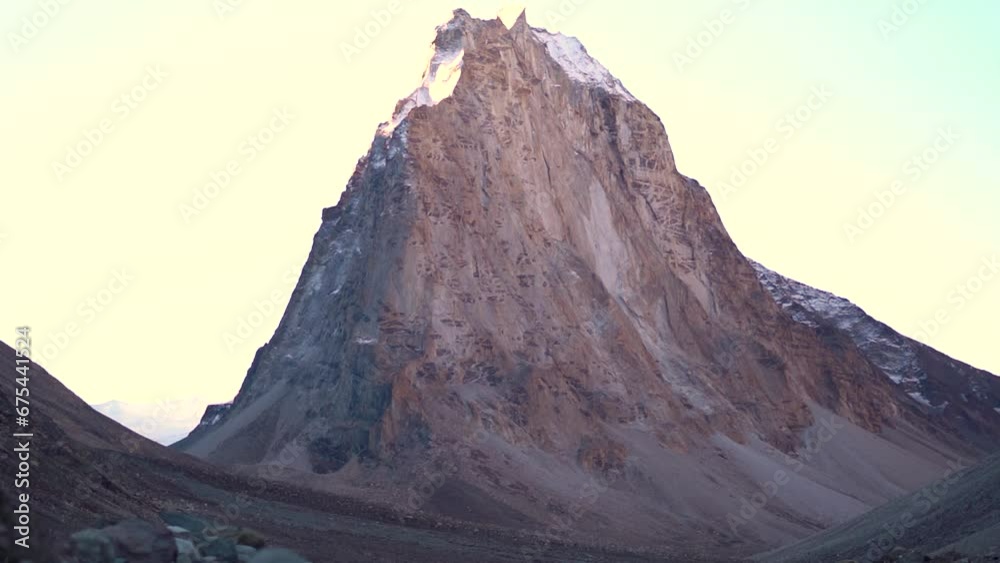 Handheld shot of clouds above the holy Gonbo Rangjon mountain during ...