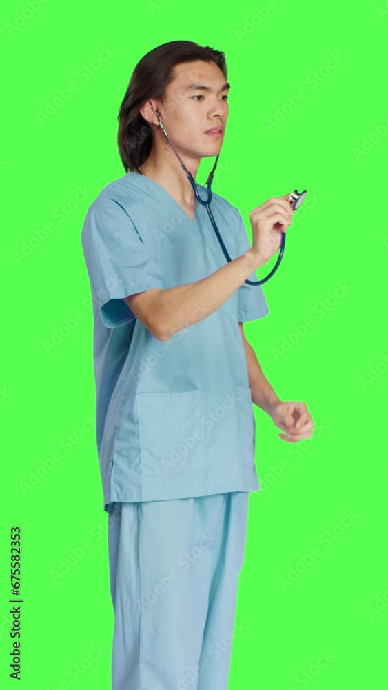 Side view of medic preparing for wellness examination at clinic using ...