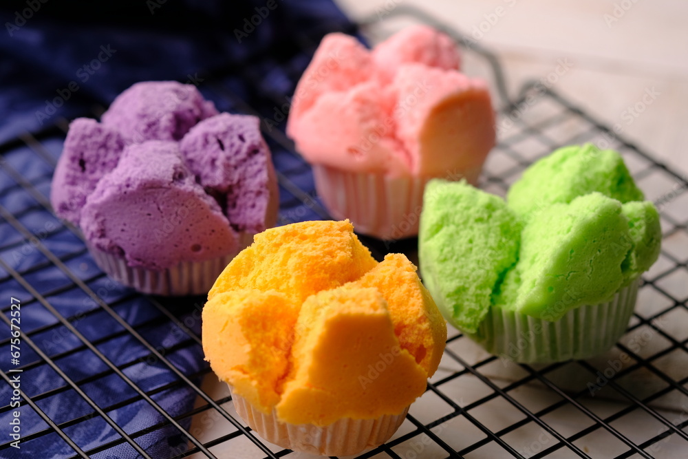 Bolu Kukus. steamed sponge cake on a cooling rack. steamed sponge cake ...