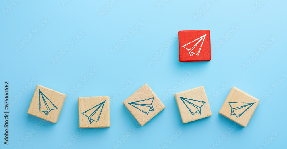 Red wooden blocks with paper plane icons that are different from the ...