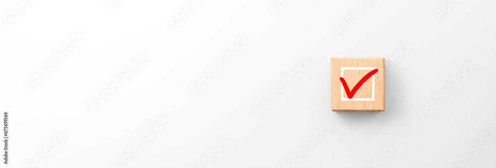 Checklist concept, Red marking on checklist box on wooden block, white ...