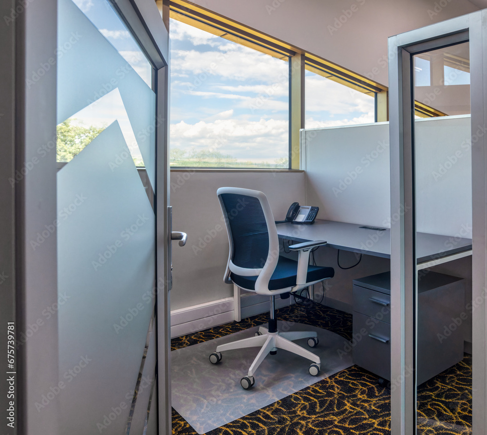generic neat and empty cubical in an office space at a call center ...