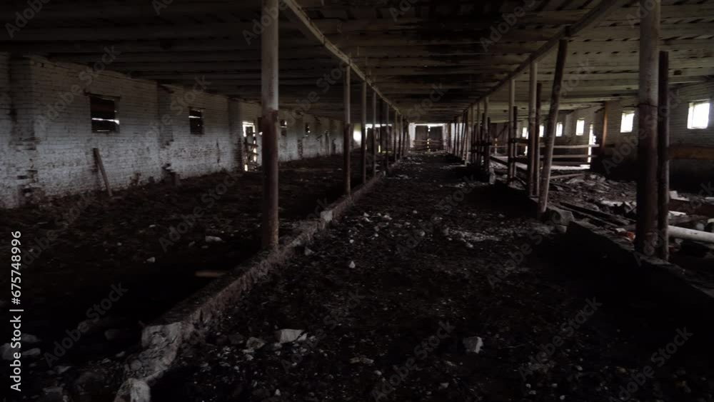 Abandoned ruined barn cowshed inside view. The old abandoned barn with ...