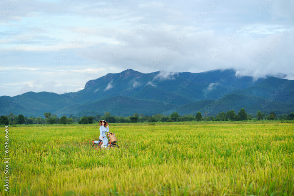 Beautiful Vietnamese Asian woman wearing a blue color Ao Dai National ...